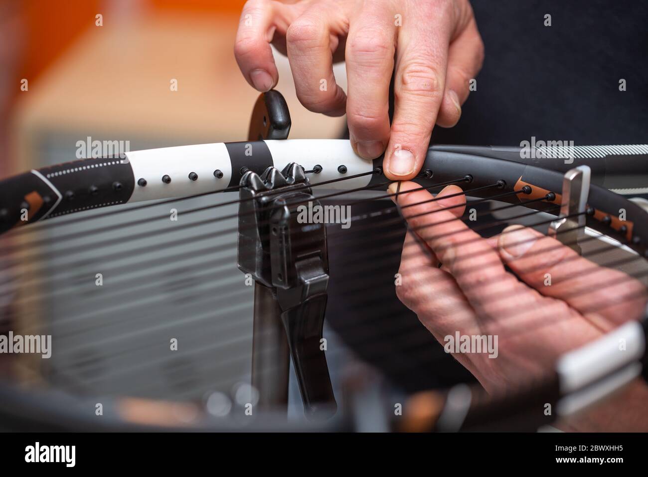 Process of stringing a tennis racket in a tennis shop, sport and ...