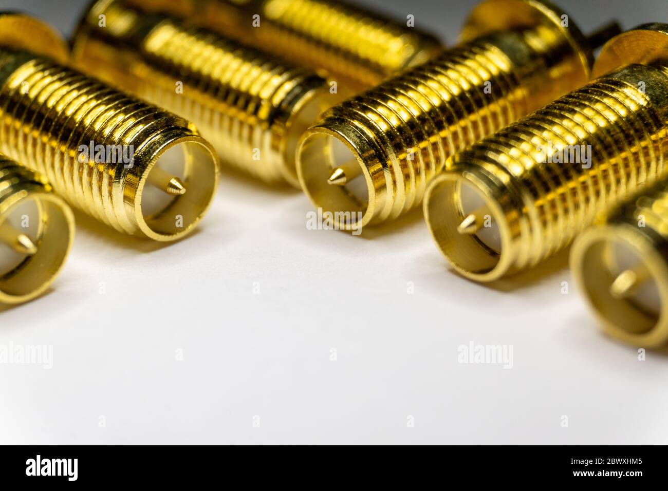 Close-up of symmetric aligned gold plated SMA male connectors ...