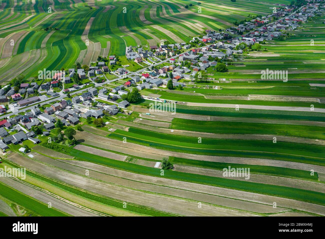 Poland from above. Aerial view of green agricultural fields and village ...