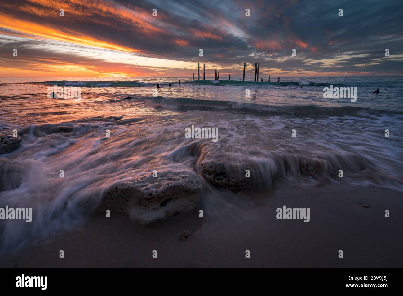 Sunset over the old jetty, Port Willunga, South Australia Stock Photo ...