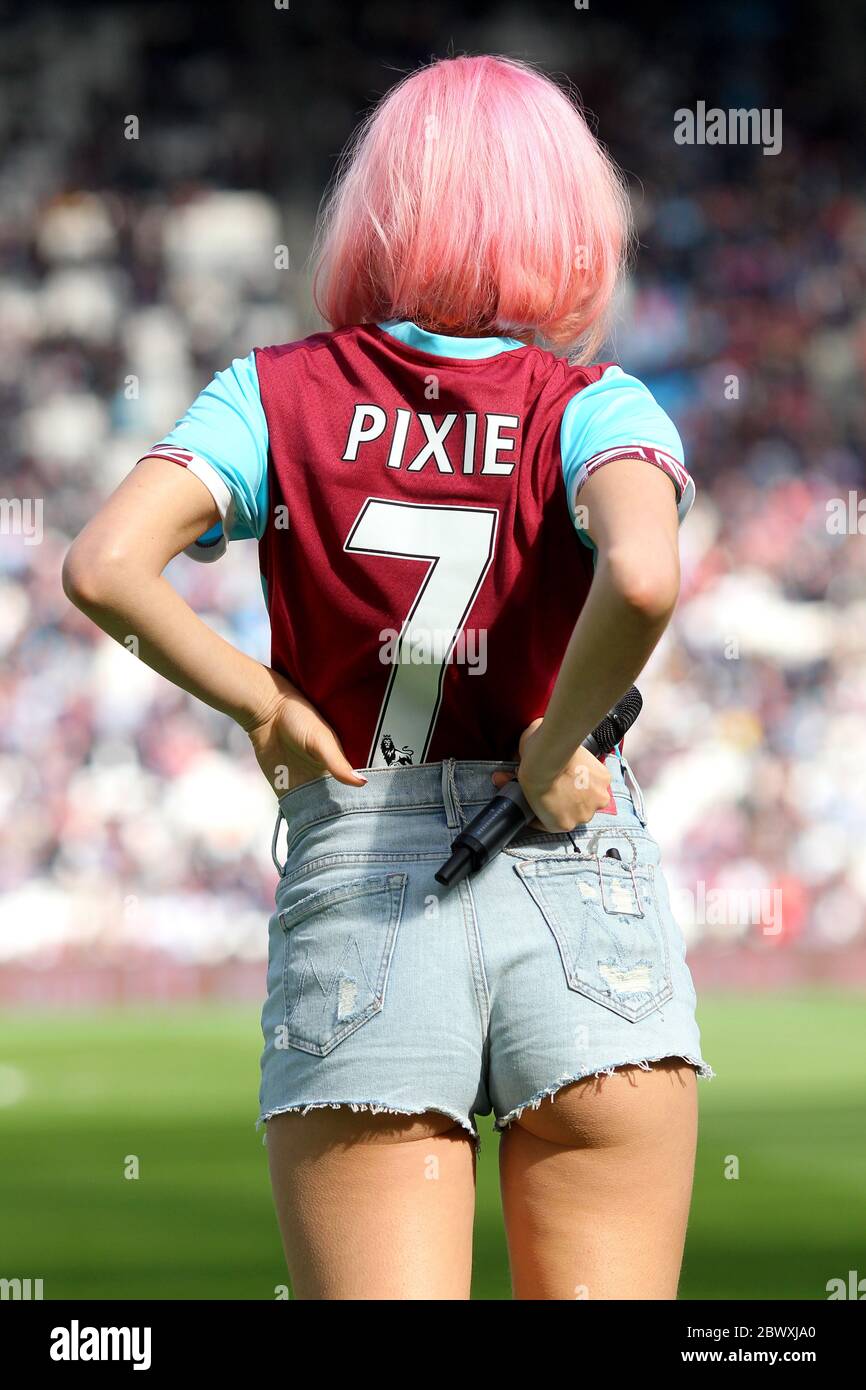 Pixie Lott stepped onto the football pitch at half time during West Ham ...