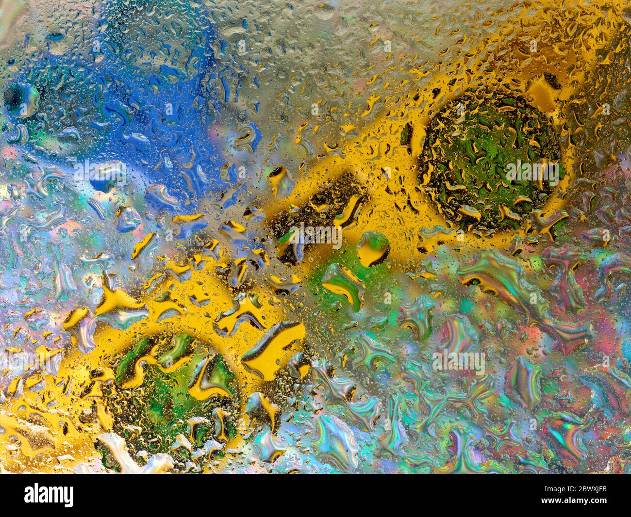 Water droplet patterns on hard surface with colourful background Stock ...