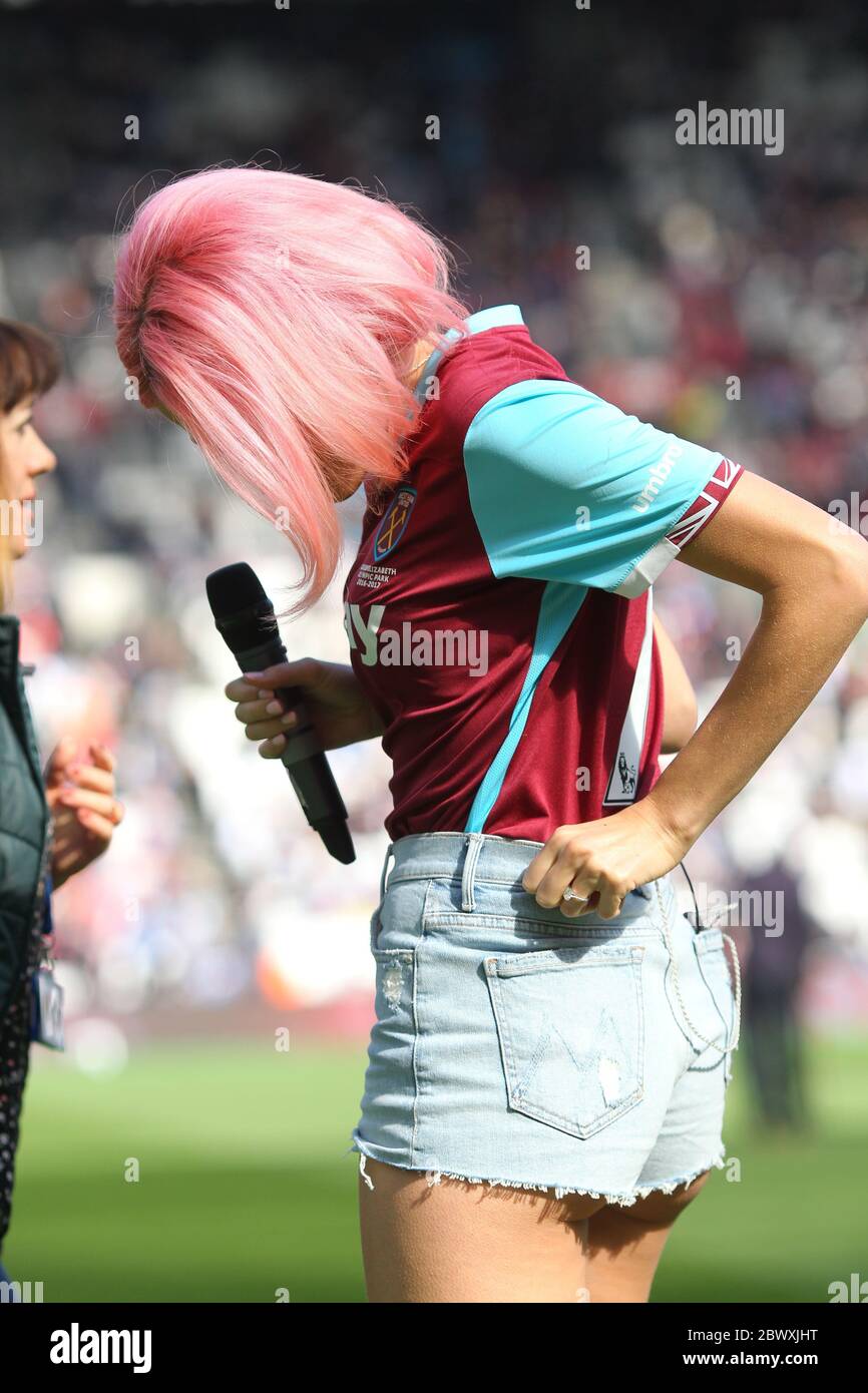 Pixie Lott stepped onto the football pitch at half time during West Ham ...