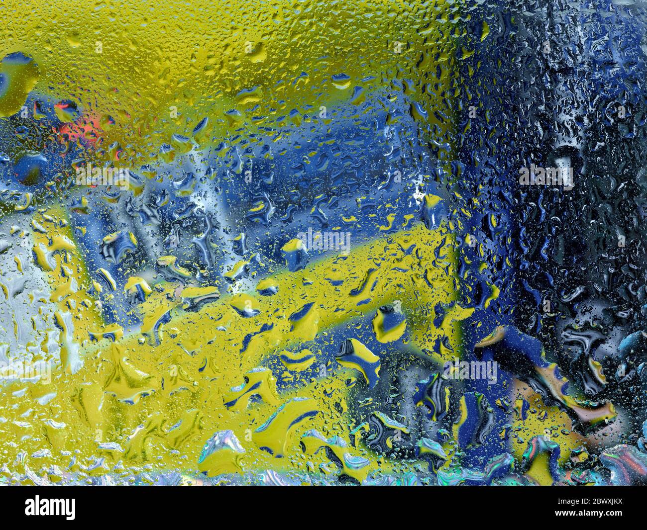 Water droplet patterns on hard surface with colourful background Stock ...