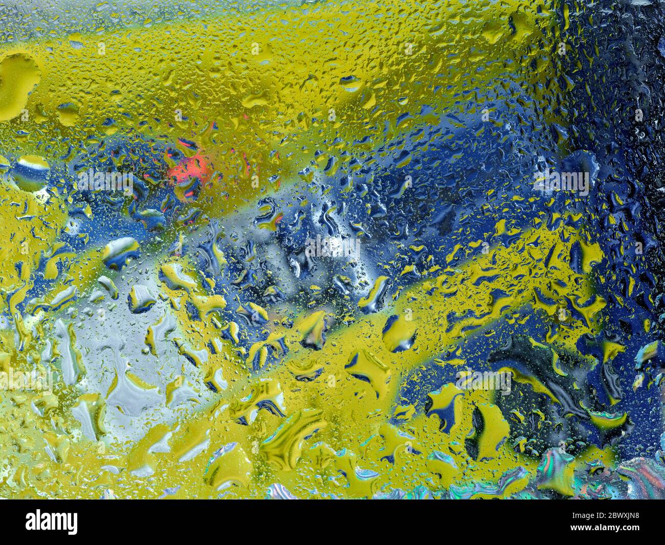 Water droplet patterns on hard surface with colourful background Stock ...