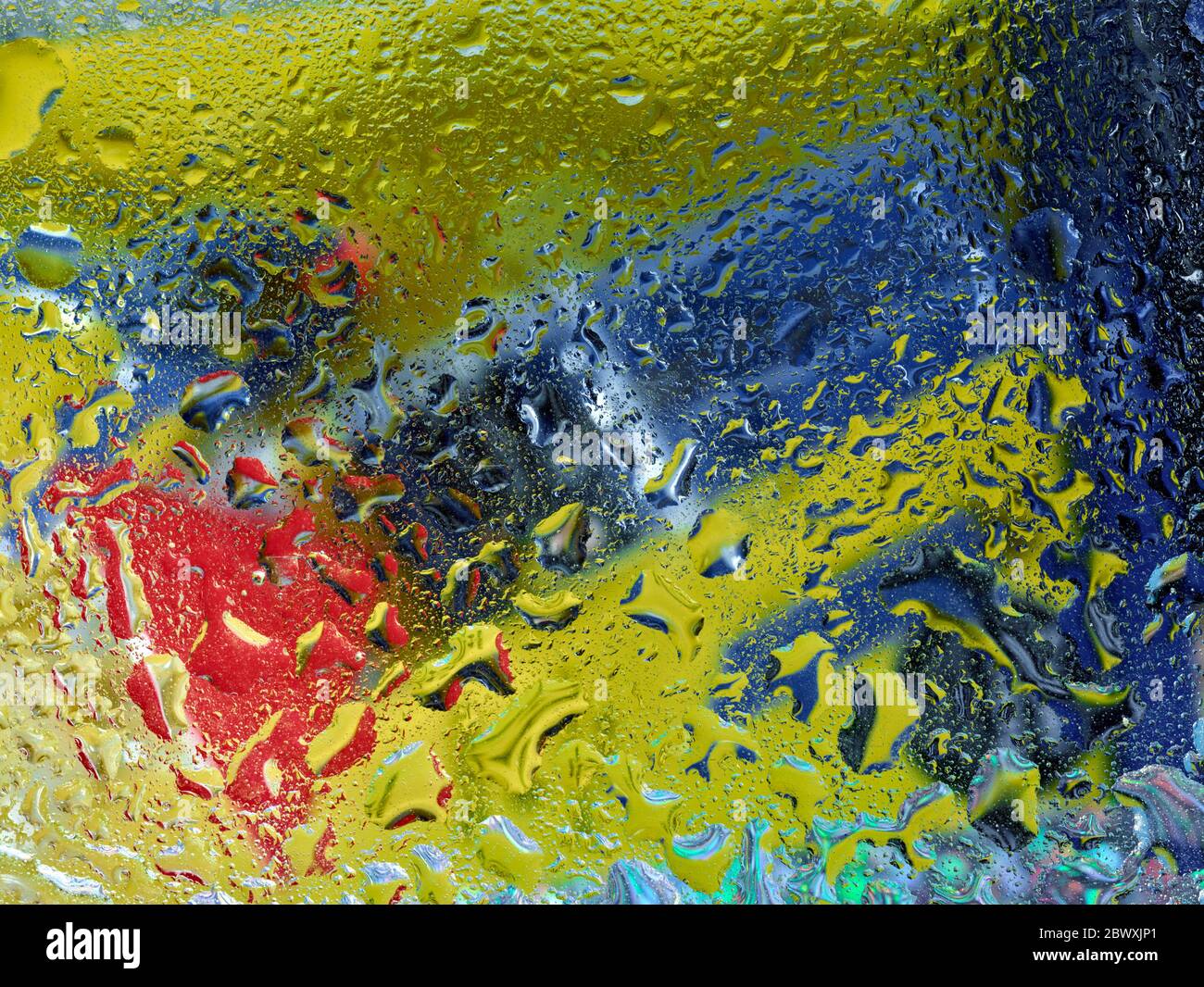 Water droplet patterns on hard surface with colourful background Stock ...