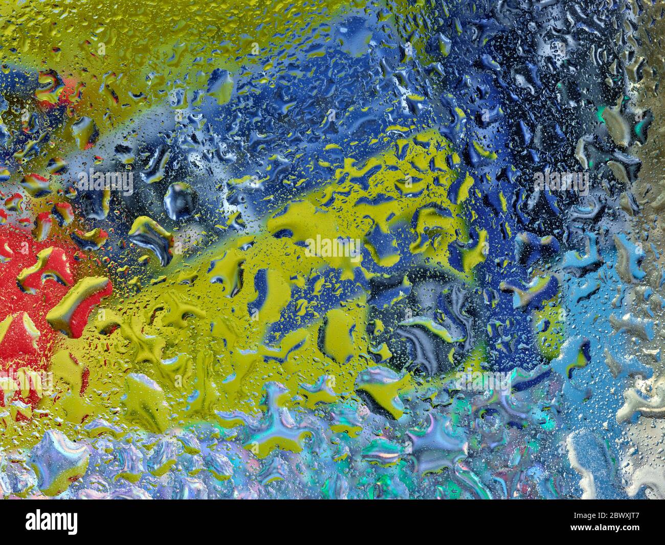 Water droplet patterns on hard surface with colourful background Stock ...