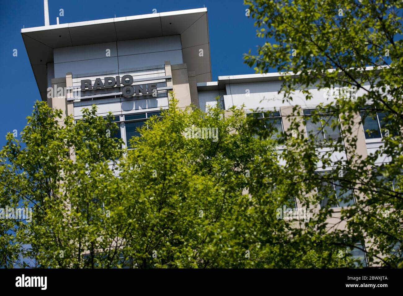 A logo sign outside of the headquarters of Radio One, also known as ...