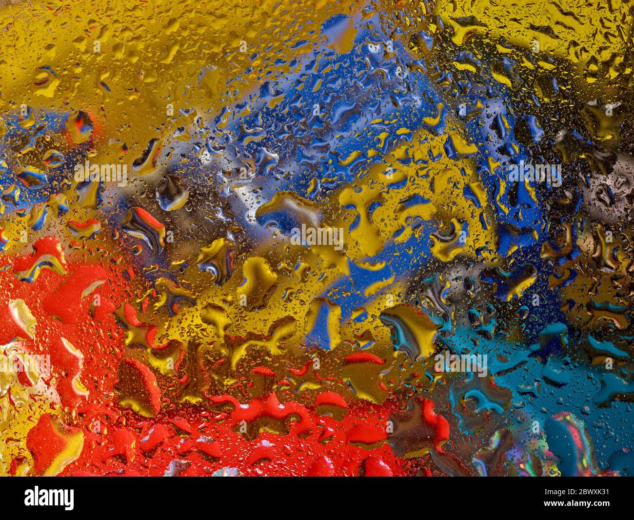 Water droplet patterns on hard surface with colourful background Stock ...