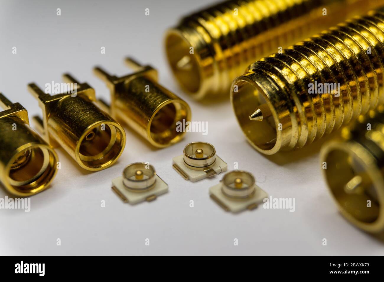 Close-up of symmetric aligned gold plated uFL, MMCX micro precision ...