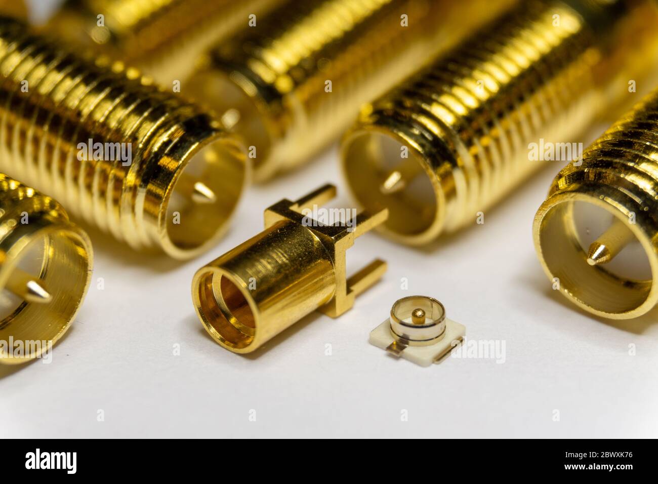 Close-up of symmetric aligned gold plated uFL, MMCX micro precision ...