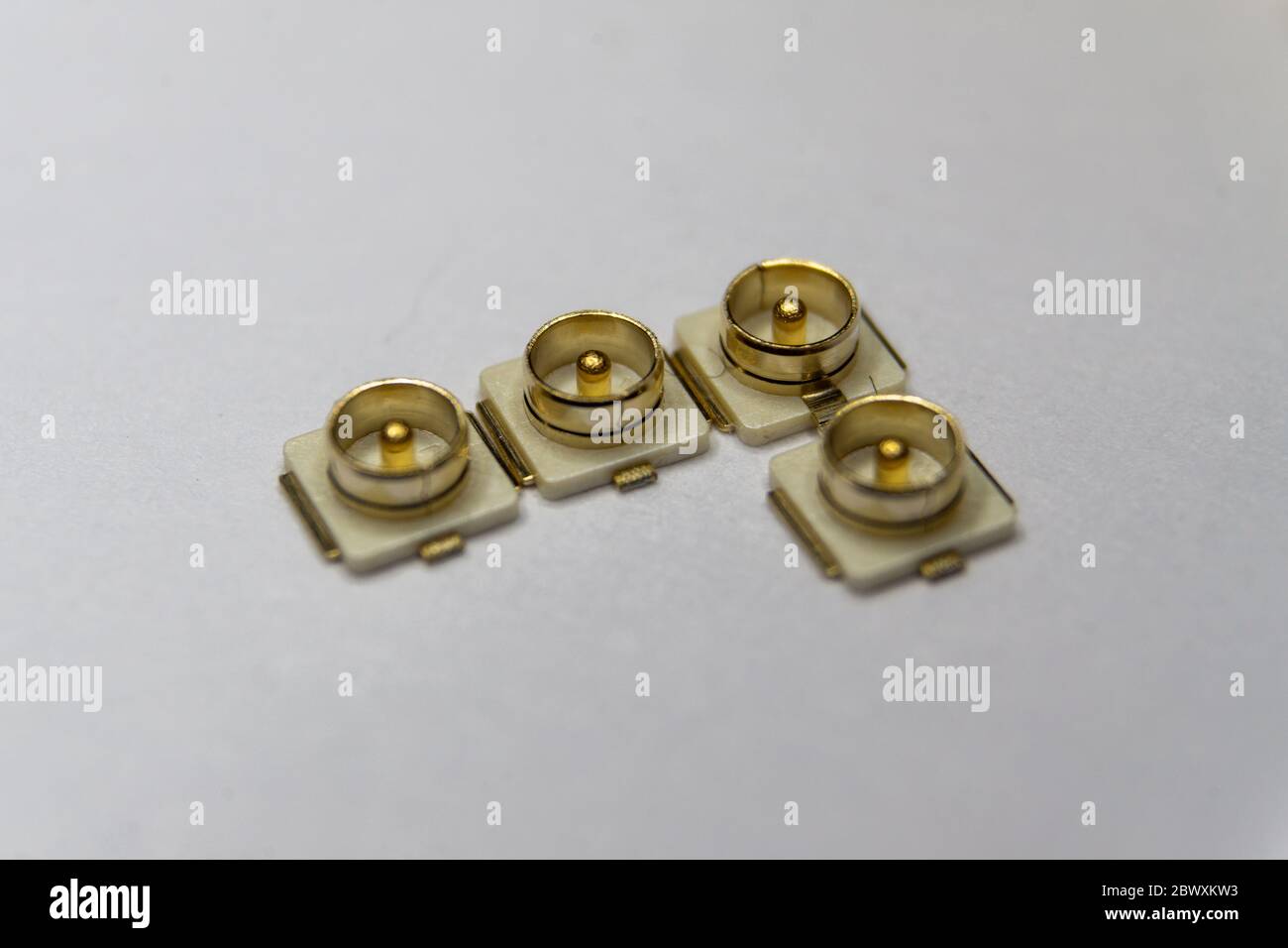 Close-up of symmetric aligned gold plated uFL micro precision radio ...