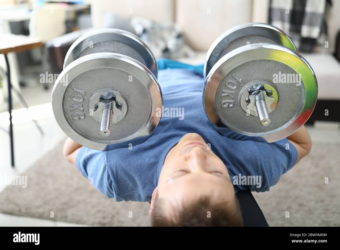 Strong guy doing hard exercises hi-res stock photography and images - Alamy