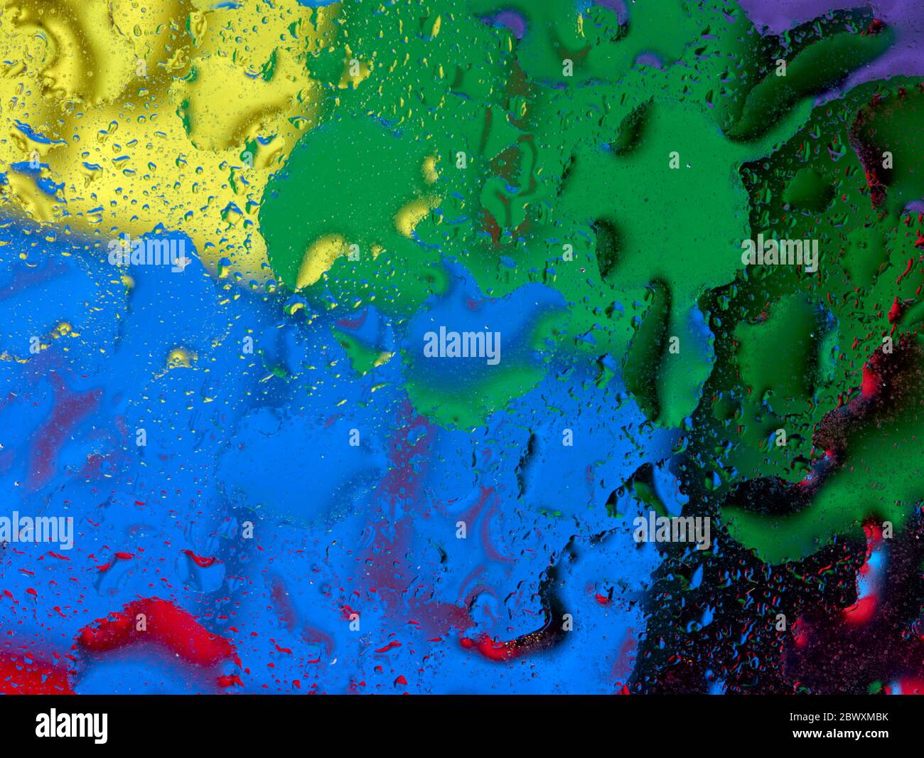Water droplet patterns on hard surface with colourful background Stock ...