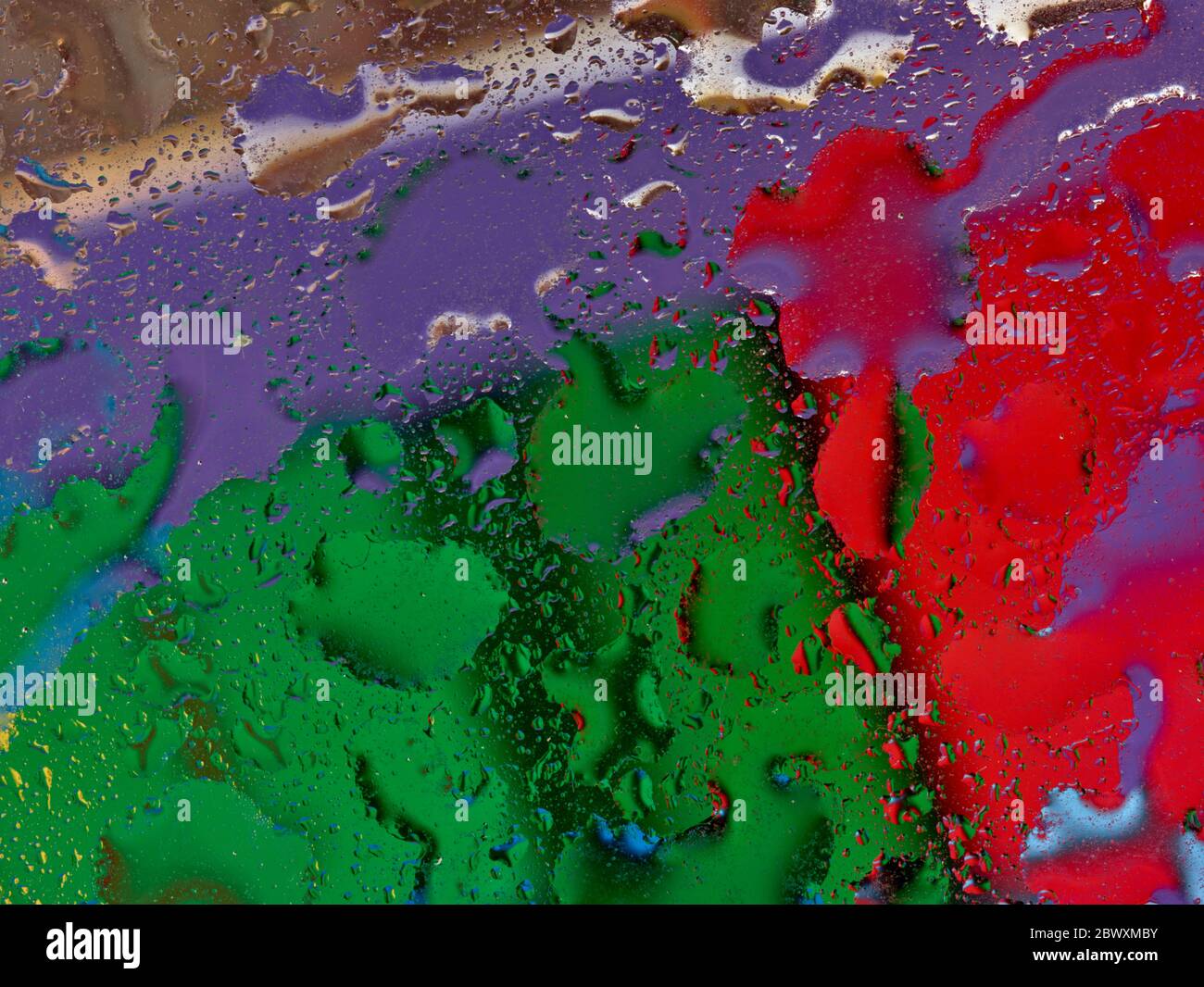 Water droplet patterns on hard surface with colourful background Stock ...