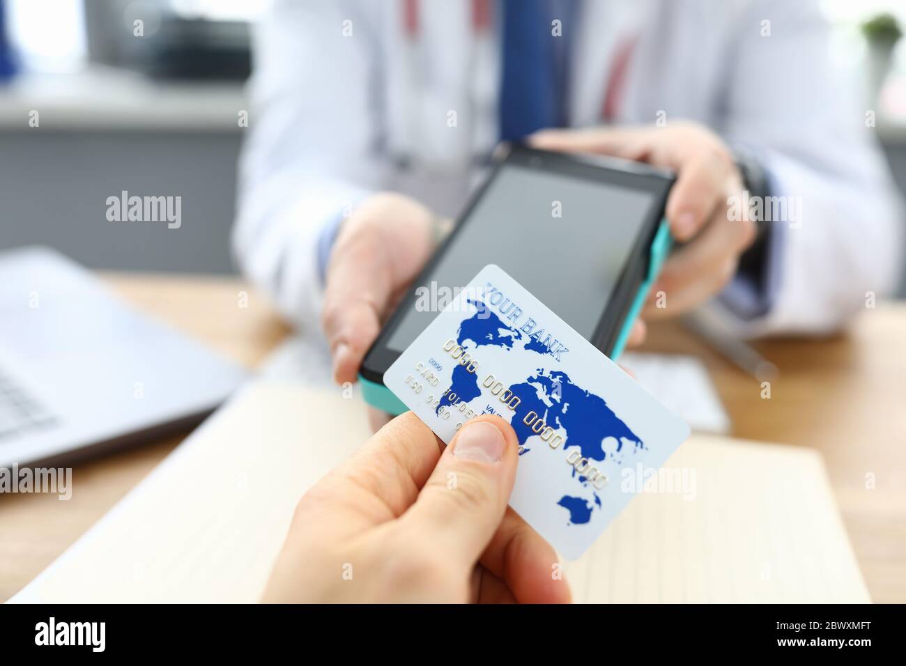 Patient clinic is calculated by doctor credit card Stock Photo - Alamy