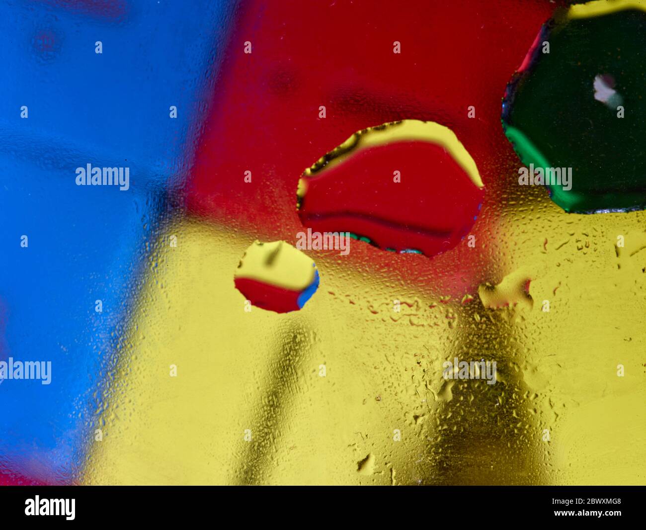 Close-up intimate landscape of water droplets on glass, abstract with ...