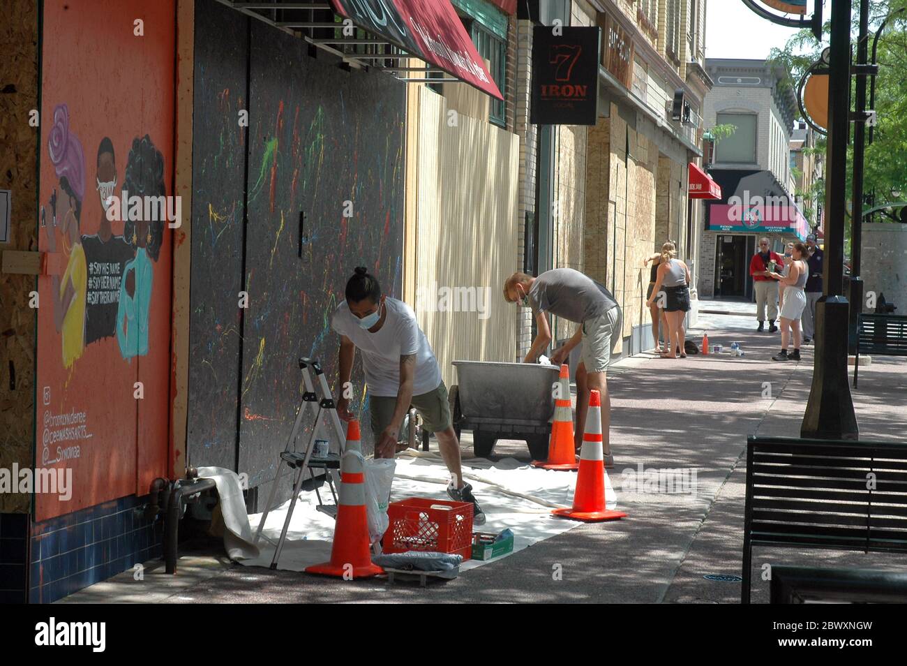 Cleaning up protest damage Stock Photo - Alamy