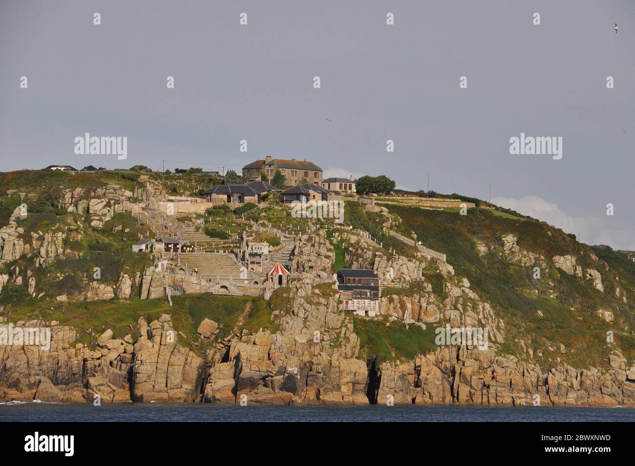 Minack theatre on the cliff face taken from the sea, Porthcurno in ...