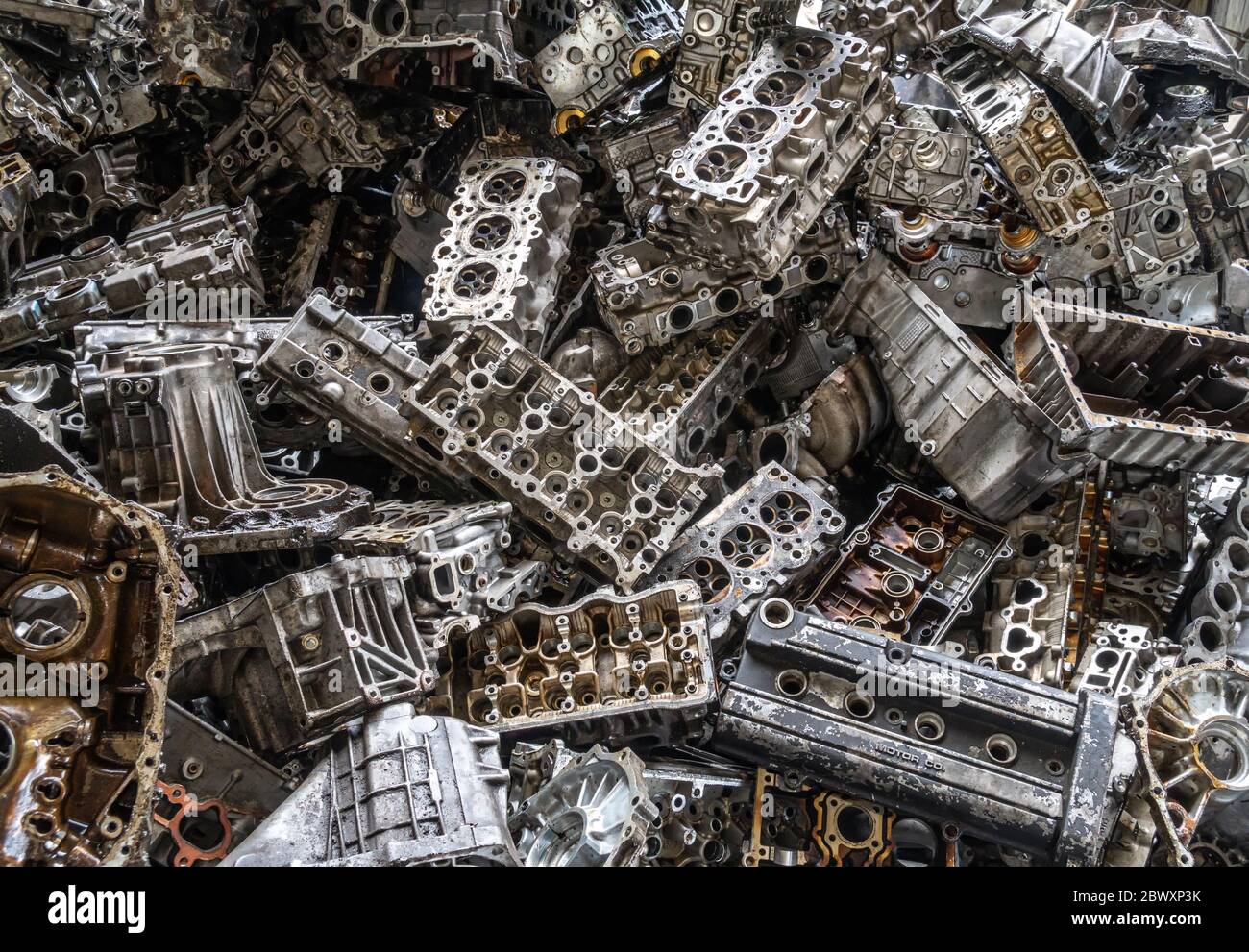 Stack of aluminium alloy cylinder head for recycling Stock Photo - Alamy