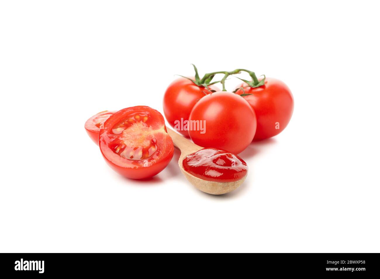 Tomatoes and spoon with sauce isolated on white background Stock Photo ...