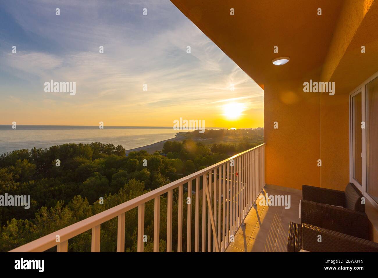 Beautiful sunset over the sea view from balcony Stock Photo - Alamy