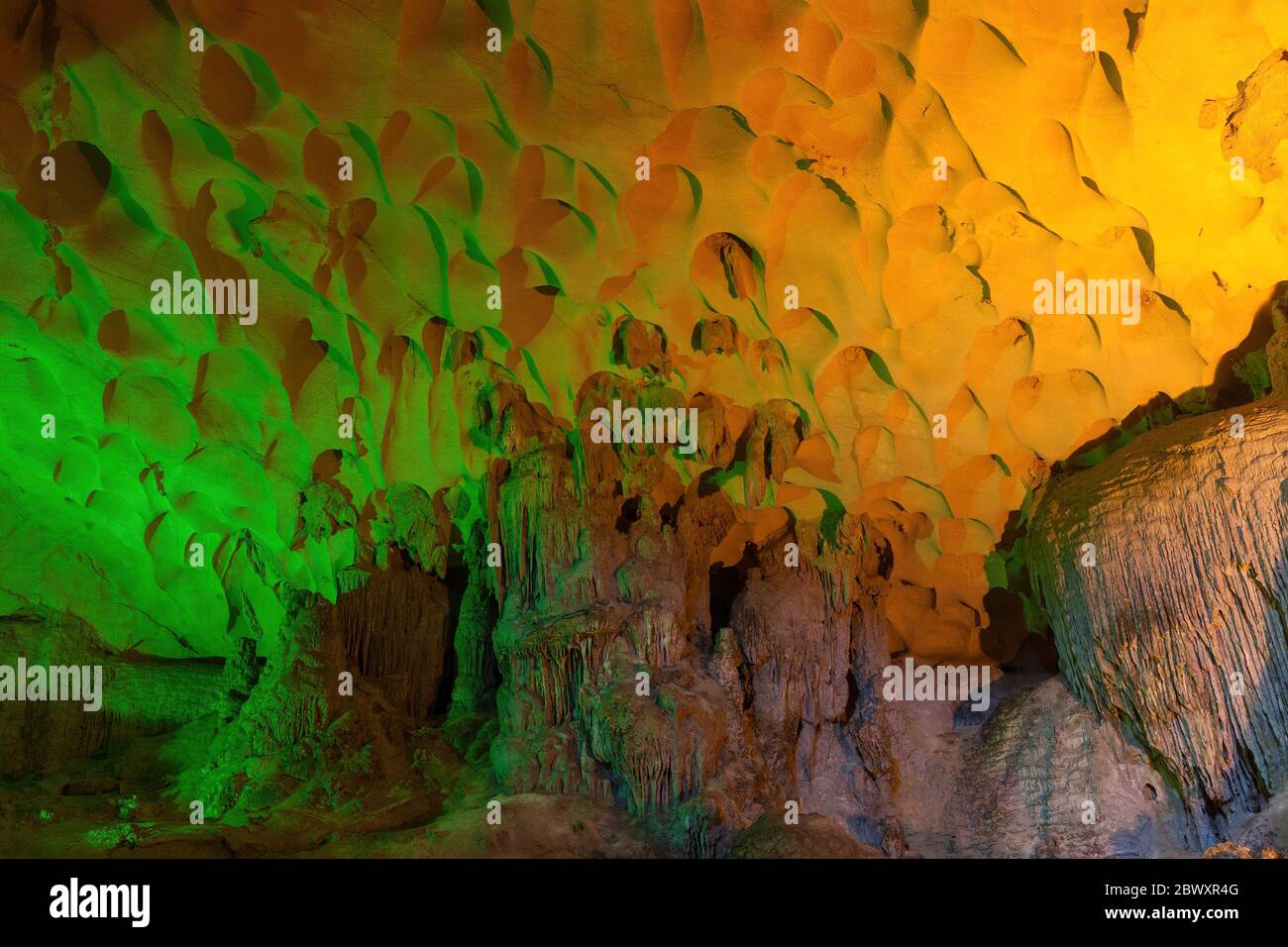 Stalactite and stalagmite formations in a limestone cave of Halong Bay ...