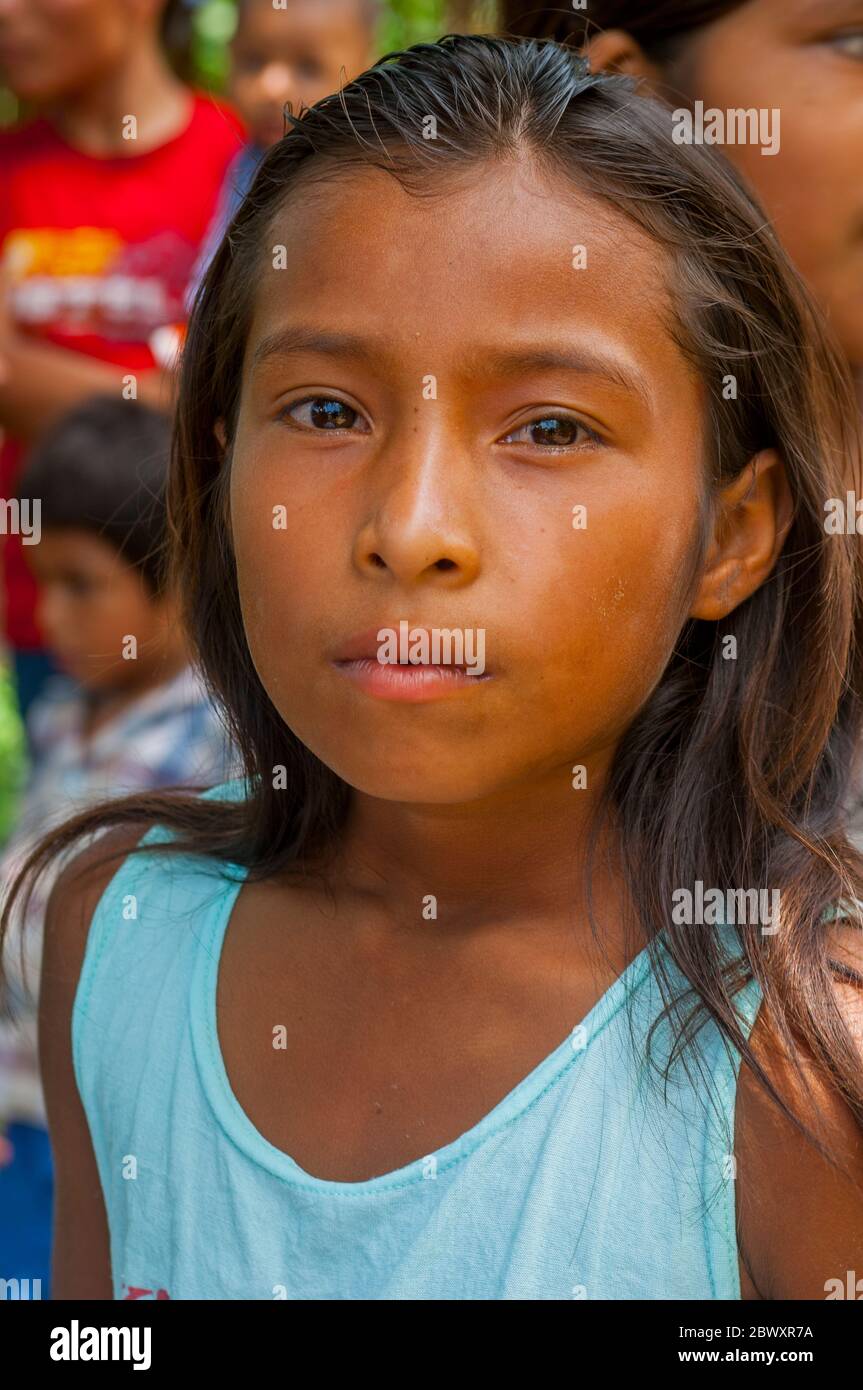 Portrait of a young girl in the village of Puerto Rico along the ...
