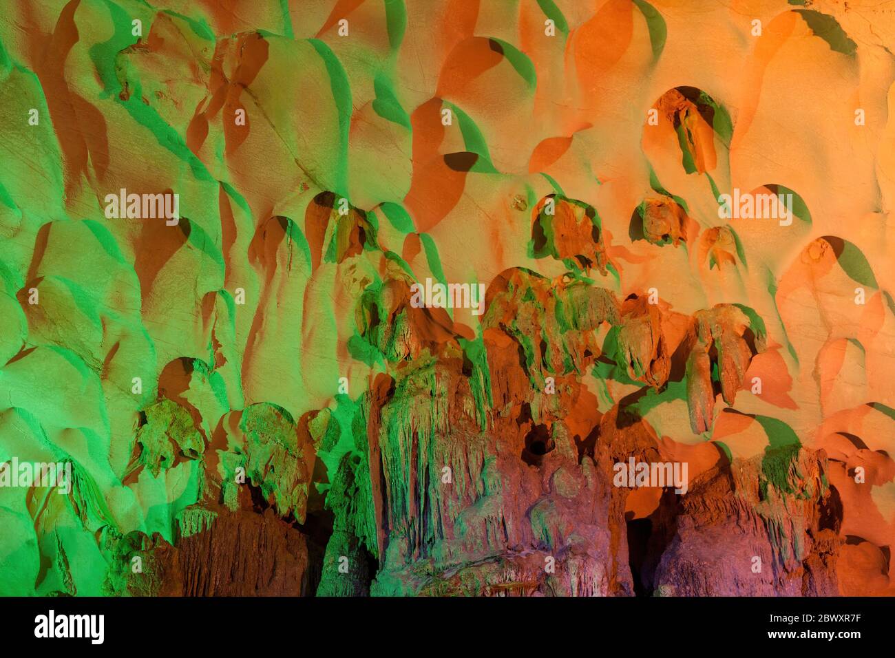Stalactite and stalagmite formations in a limestone cave of Halong Bay ...