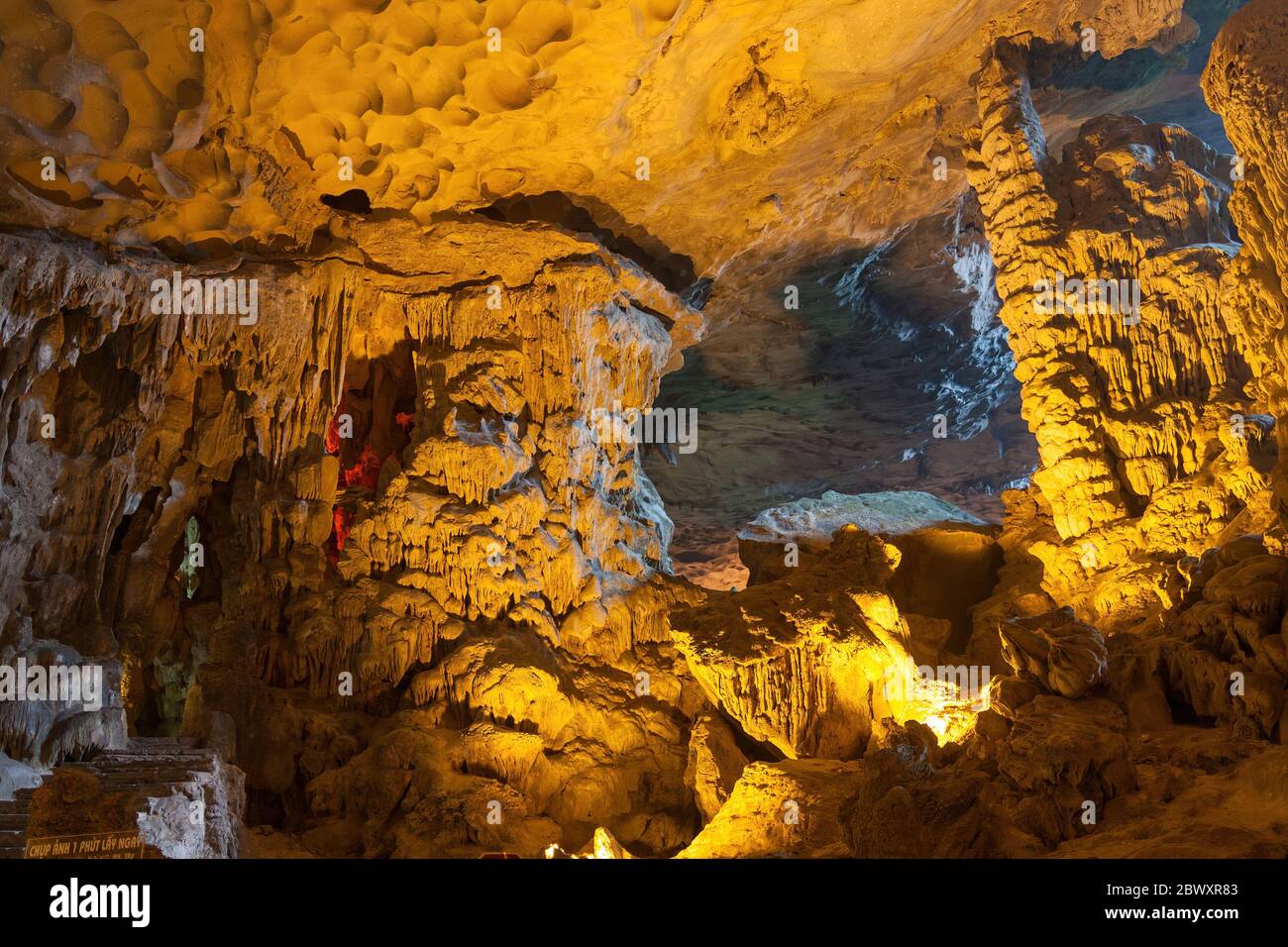 Stalactite and stalagmite formations in a limestone cave of Halong Bay ...