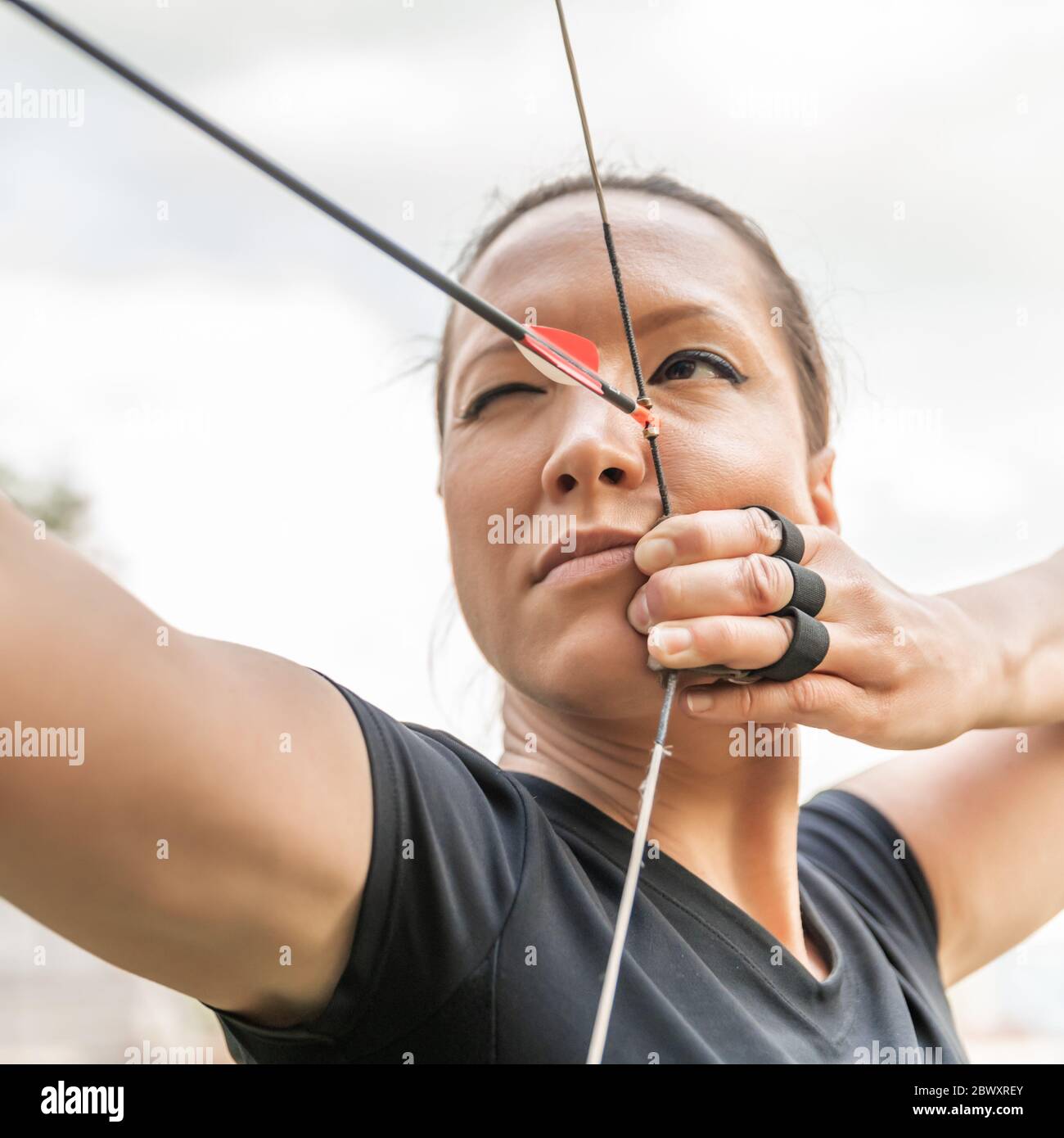 Female archer aiming target hi-res stock photography and images - Alamy