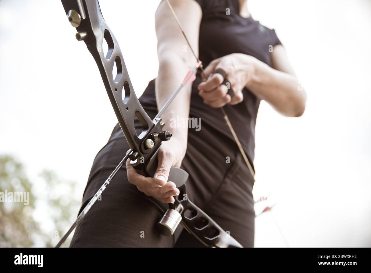 Deploy the arrow to shoot from the archery bow Stock Photo - Alamy