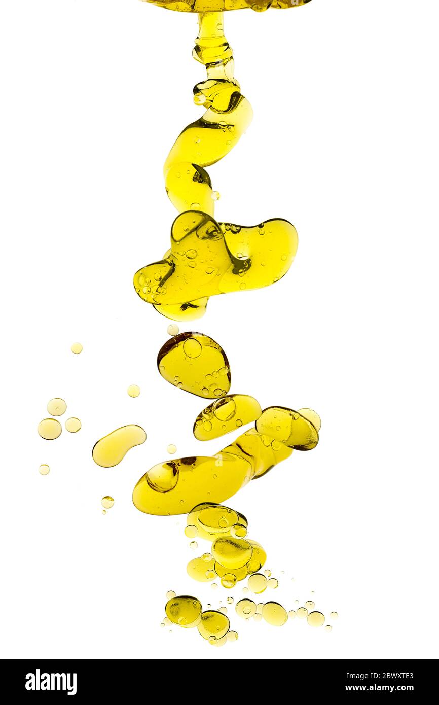 Drops of Olive Oil Suspended and Floating in Water Isolated on White ...