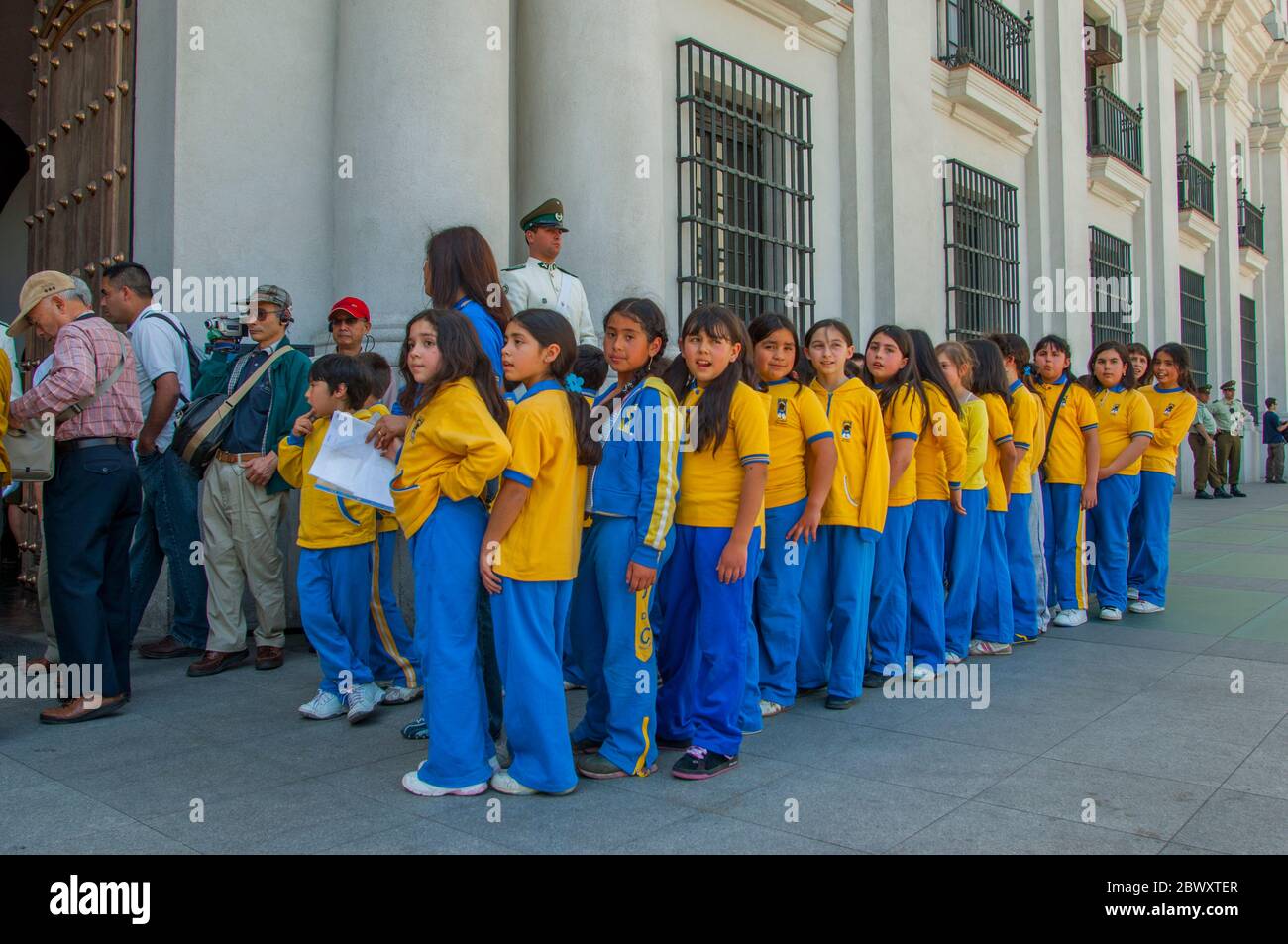 Street scene with school children visiting the parliament in downtown ...