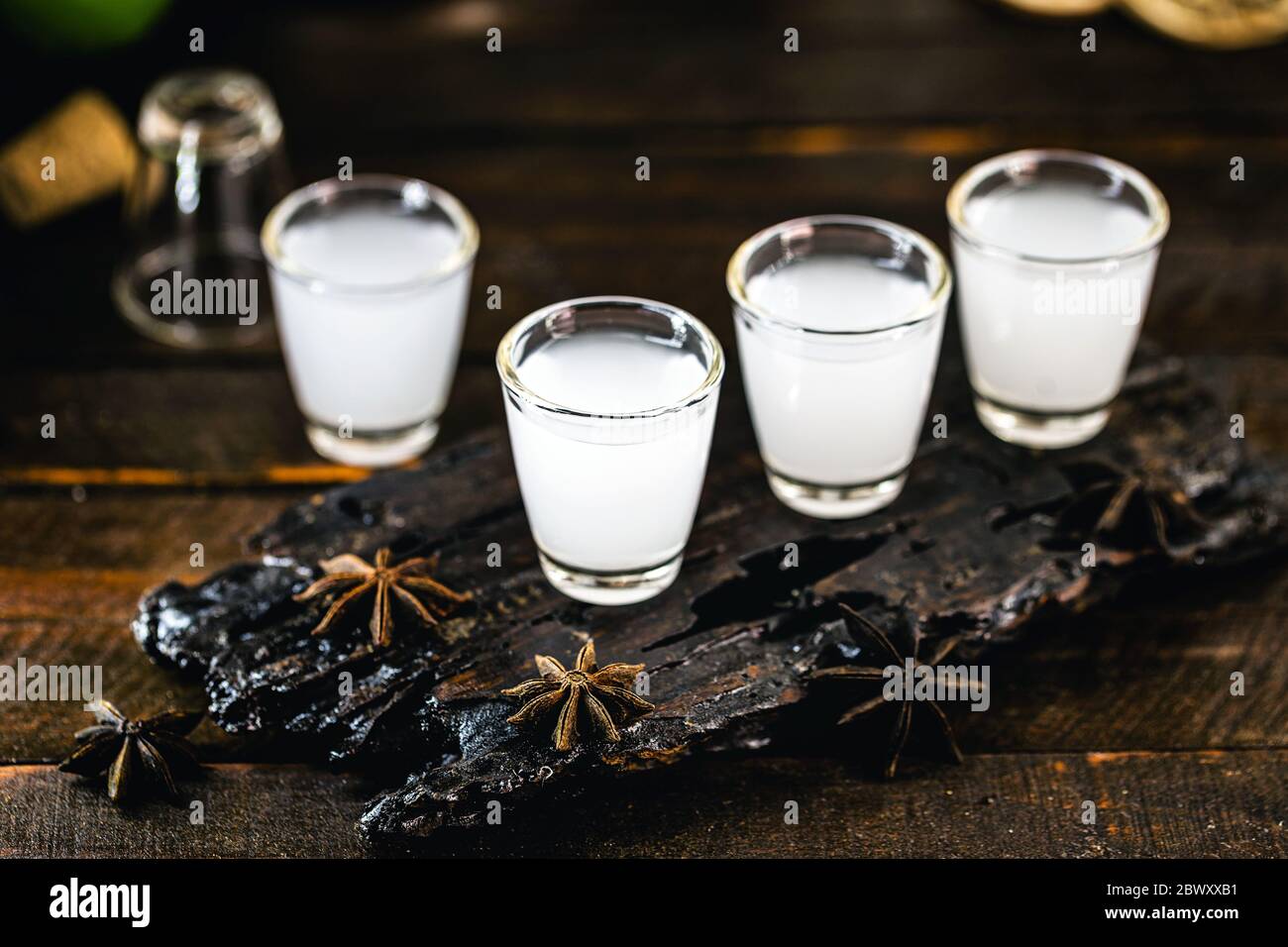 Traditional arabic alcohol drinks Raki with anise, rustic wooden ...