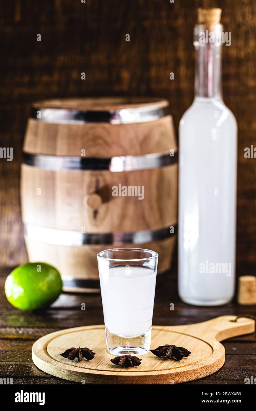 Distilled drink,anise base, on wooden background. Traditional Turkish ...