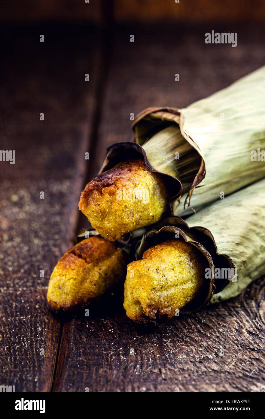 Broa made with corn and wrapped in banana leaf. Corn bread made for the ...