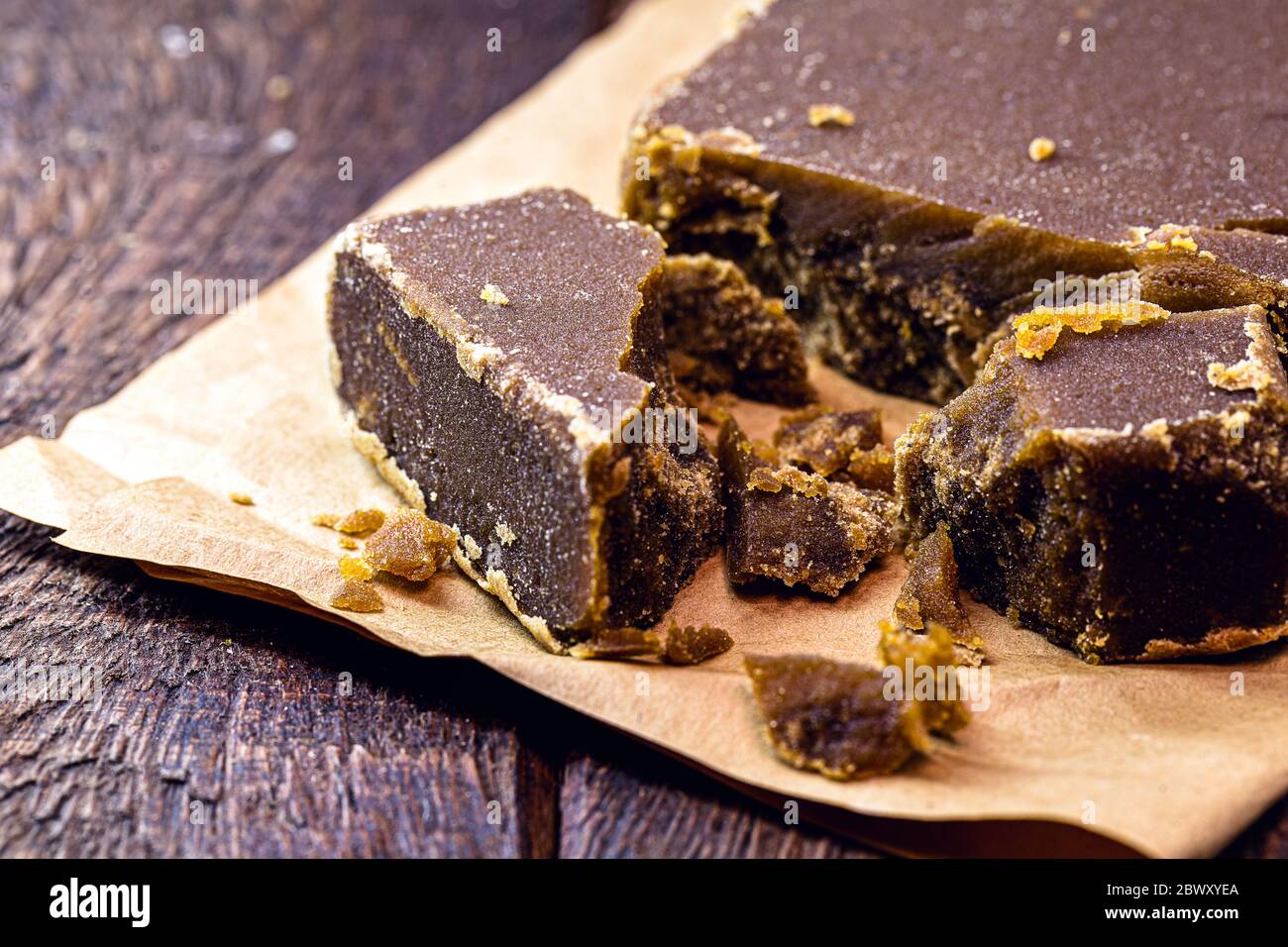 Sweet made from sugar cane, on a rustic wooden table, delicacy from ...