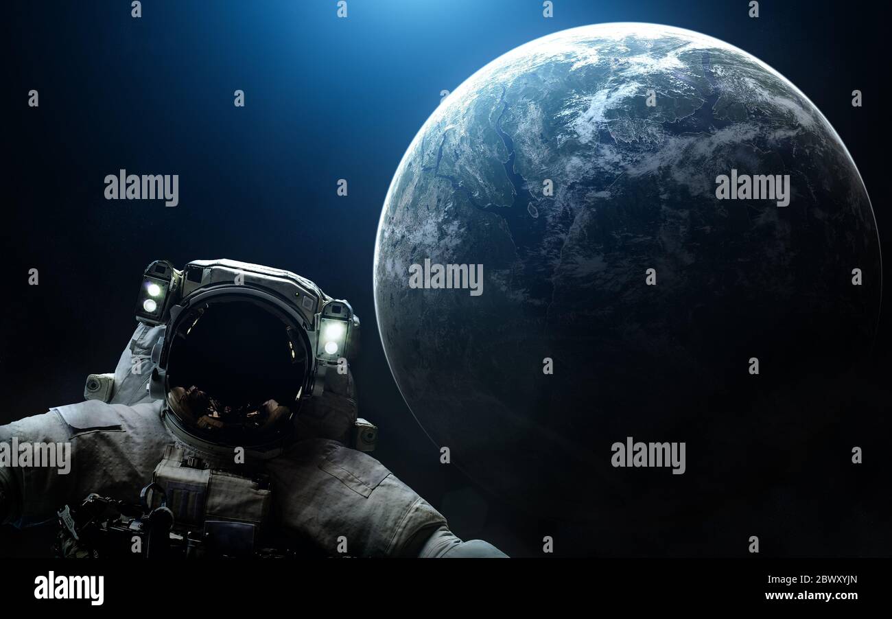 Astronaut on the background of an exoplanet in cold light Deep space ...