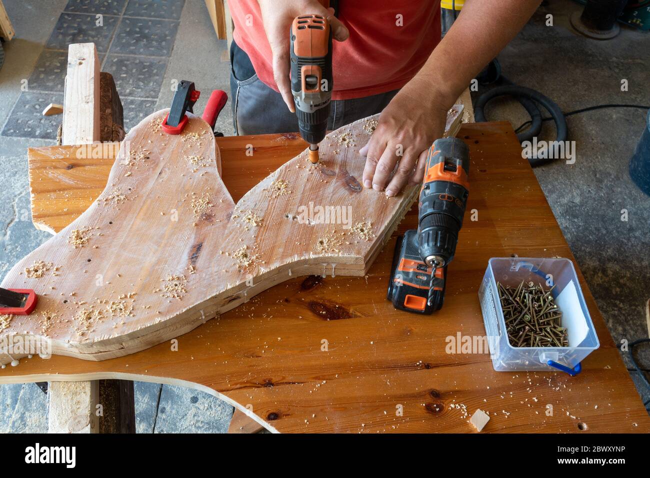 Carpenter working on wood craft at workshop to produce construction ...
