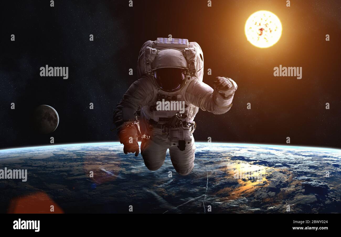 Astronaut. Landscape of Earth. Sun. Moon. Solar System Stock Photo - Alamy