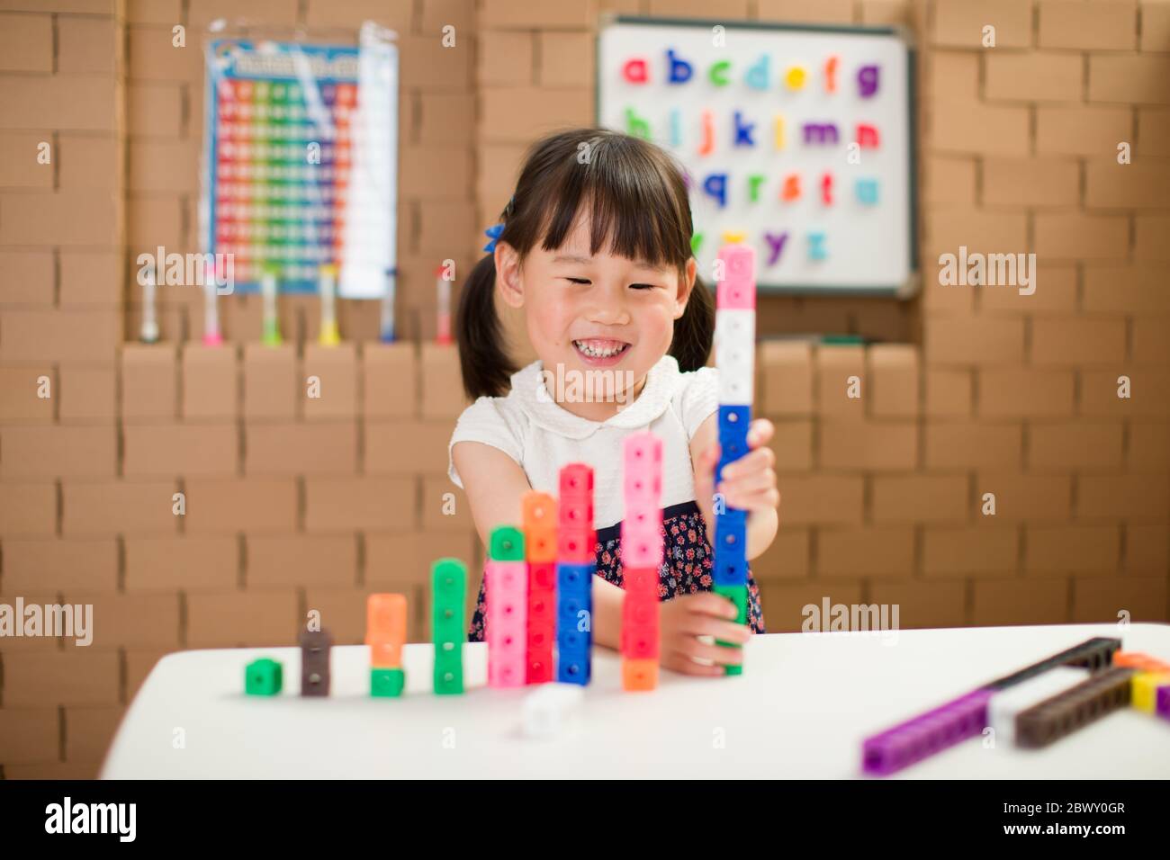 Asian little girl learning to count hi-res stock photography and images ...
