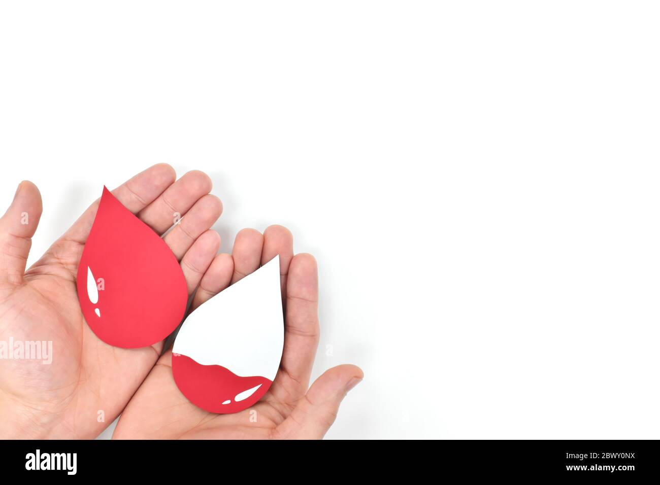 Male hands holding blood drop. Donation, anemia and transfusion concept ...