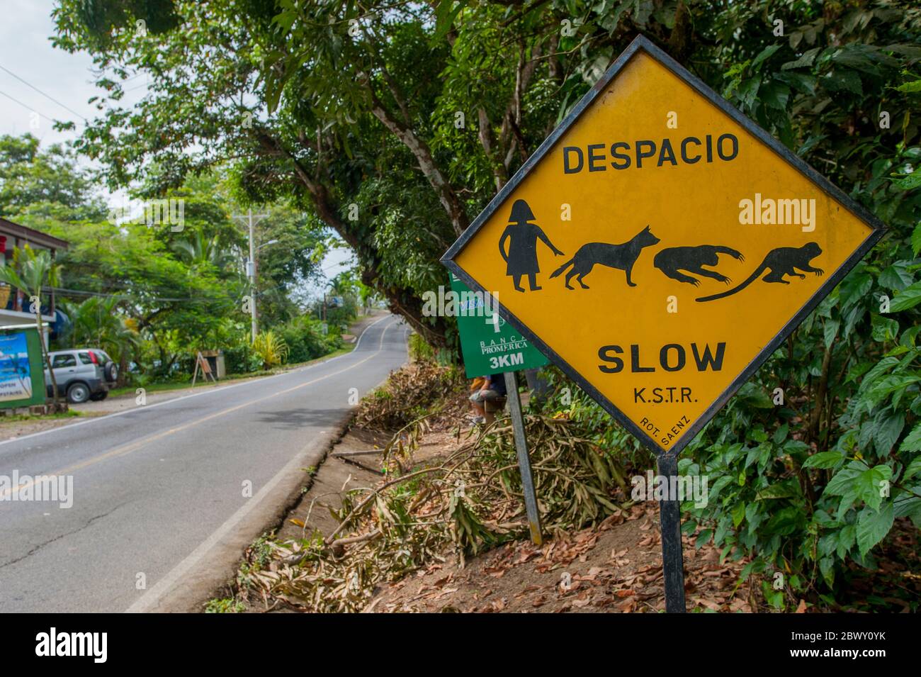 A traffic warning sign to slow down for the protection of children and ...