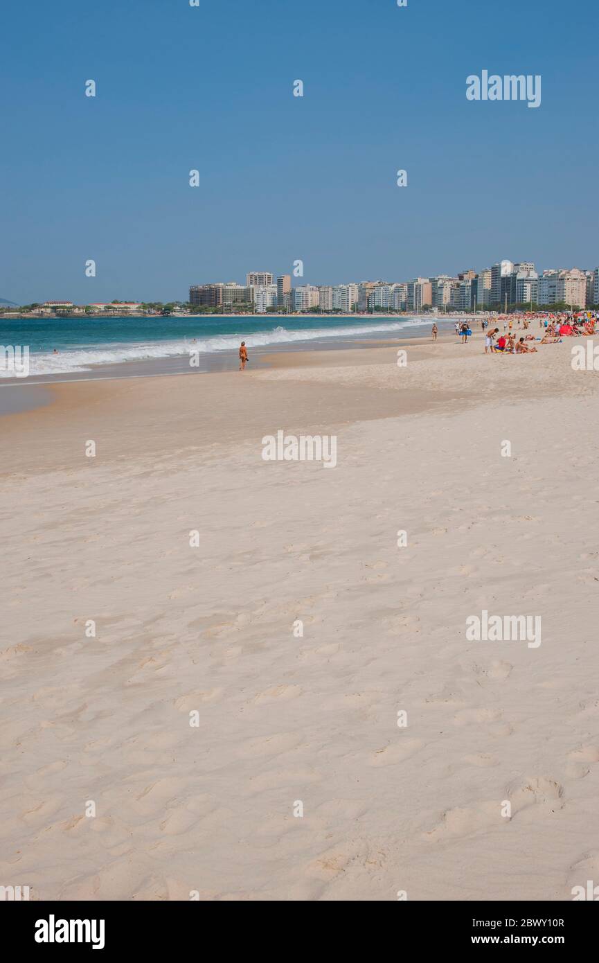 People enjoying the white sand beach of Copacabana Beach on the ...