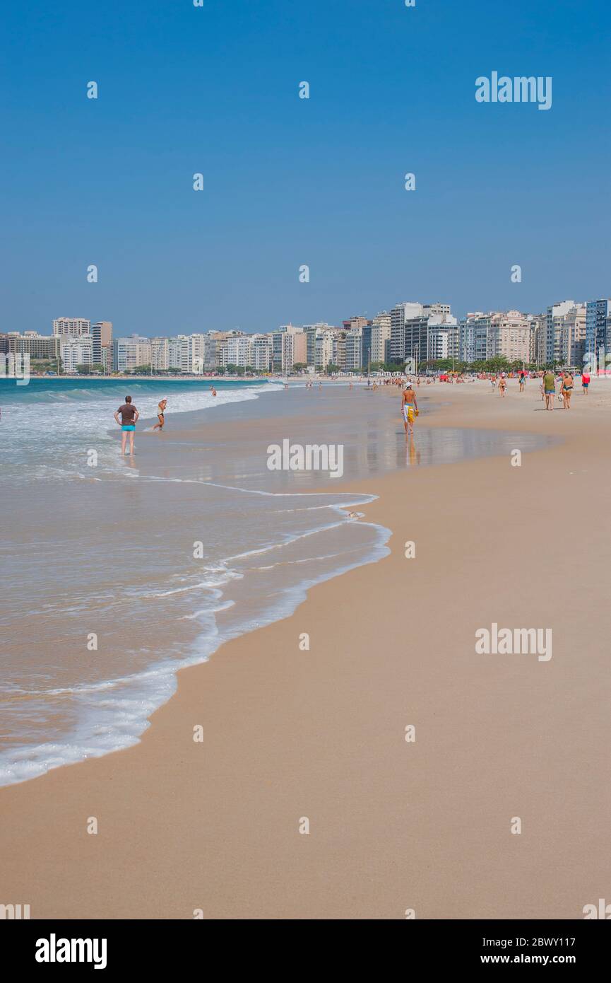 People enjoying the white sand beach of Copacabana Beach on the ...