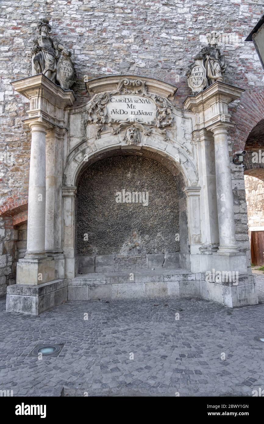 Statue of Fortitude and Constitution on ancient sandstone gate on the ...
