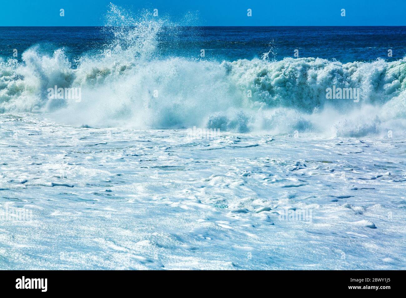 Big blue ocean waves with white foam Stock Photo - Alamy