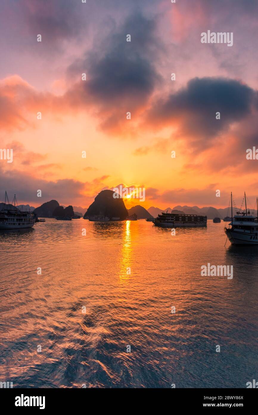 Amazing sunset over Ha Long Bay, Vietnam Stock Photo - Alamy