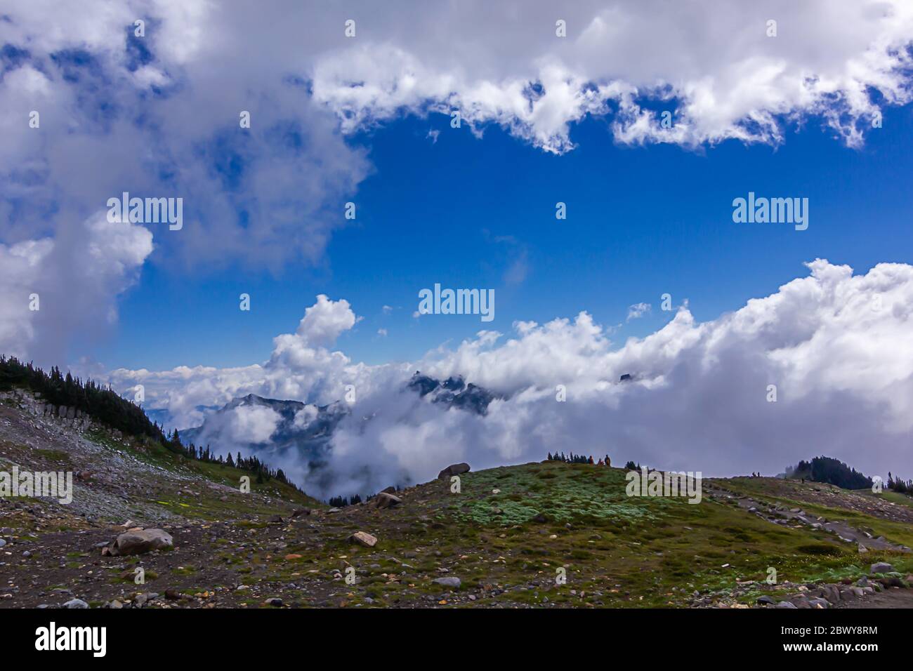 harsh vocanic soil lookout with clouds and fog floating above hiding ...